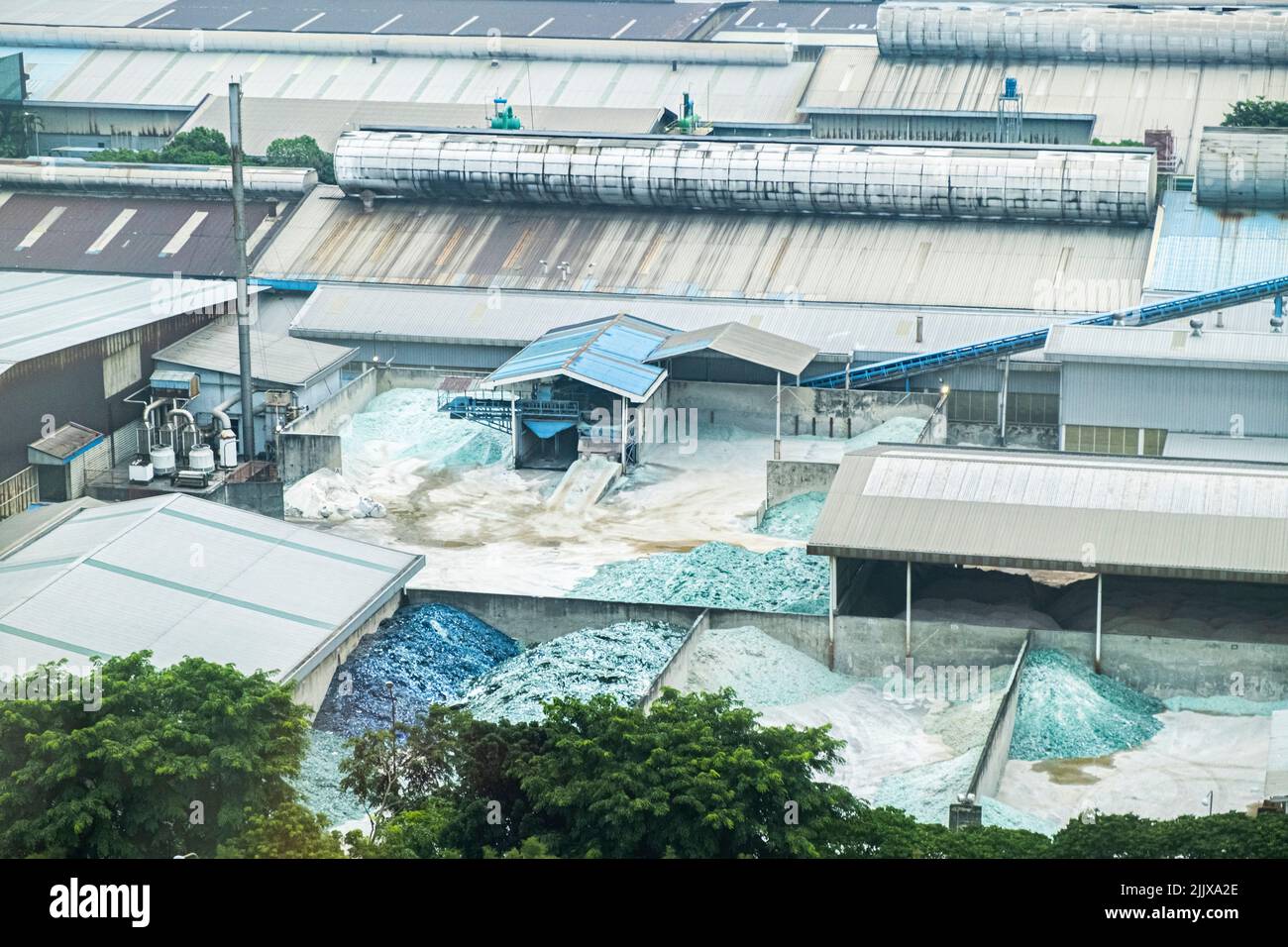 Glass factory. Top view of the piles of crushed glass on the territory ...