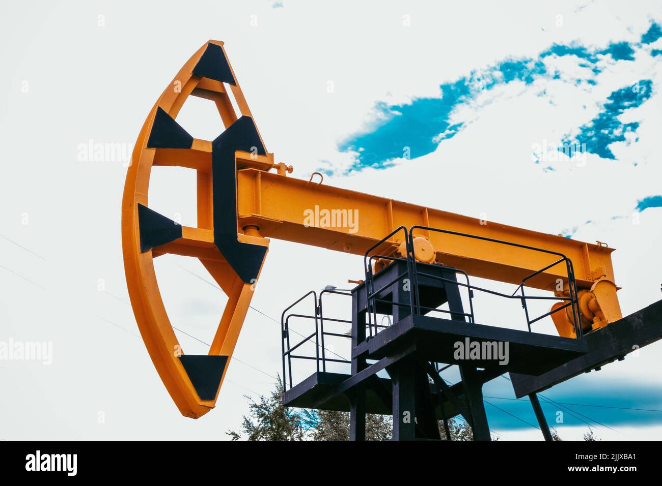 Oil and gas production equipment running on a summer day. The concept ...