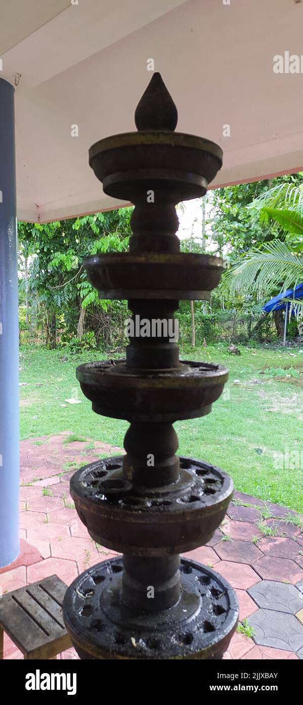 Kalvilakku, A traditional wick stand of Kerala Temple Stock Photo - Alamy