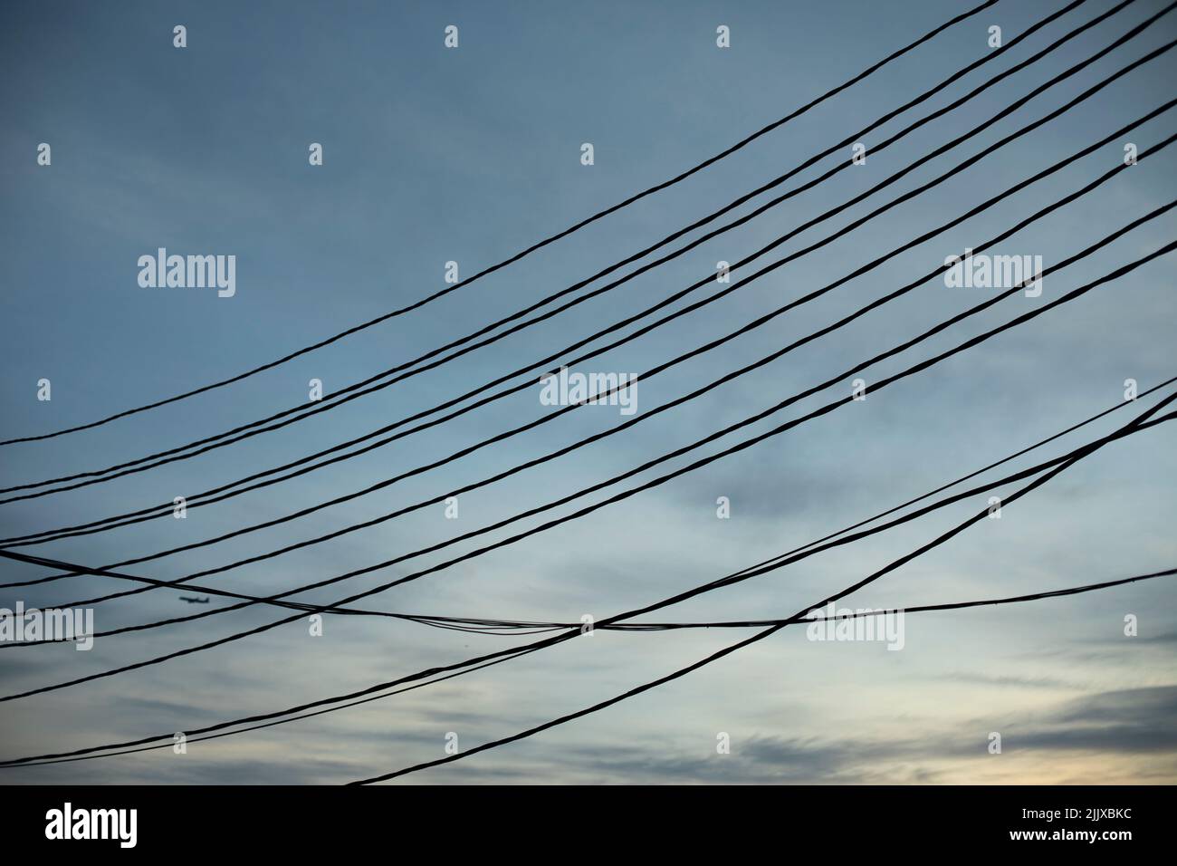 Electrical wires on pole. Many wires against sky. High voltage pole ...