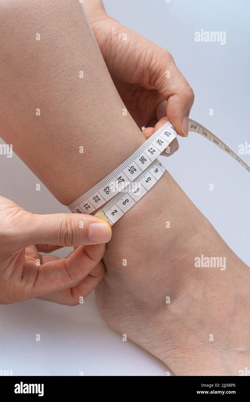 Tape measure to measure various body parts Stock Photo - Alamy