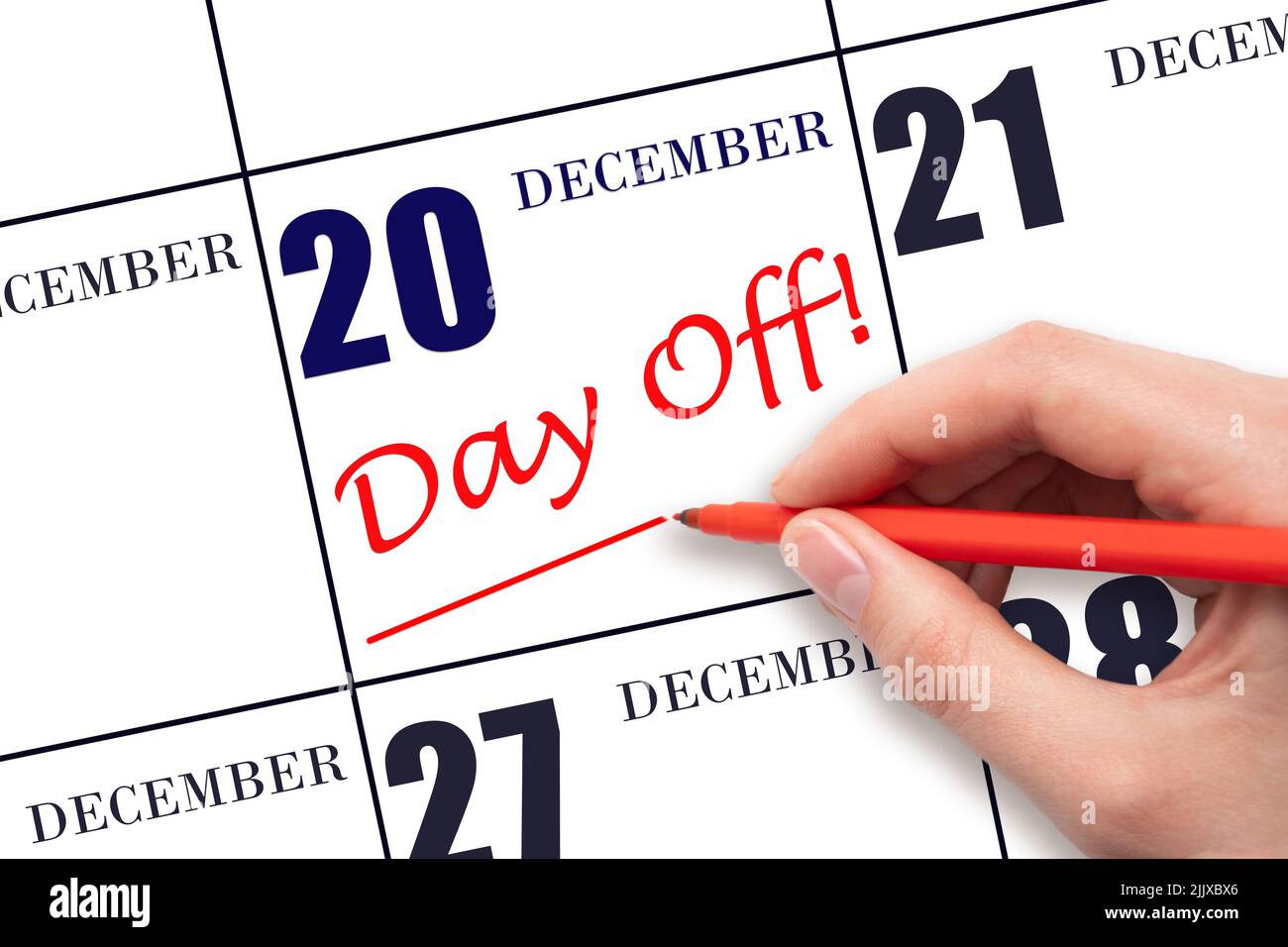 20th day of December. Hand writing text DAY OFF and drawing a line on ...