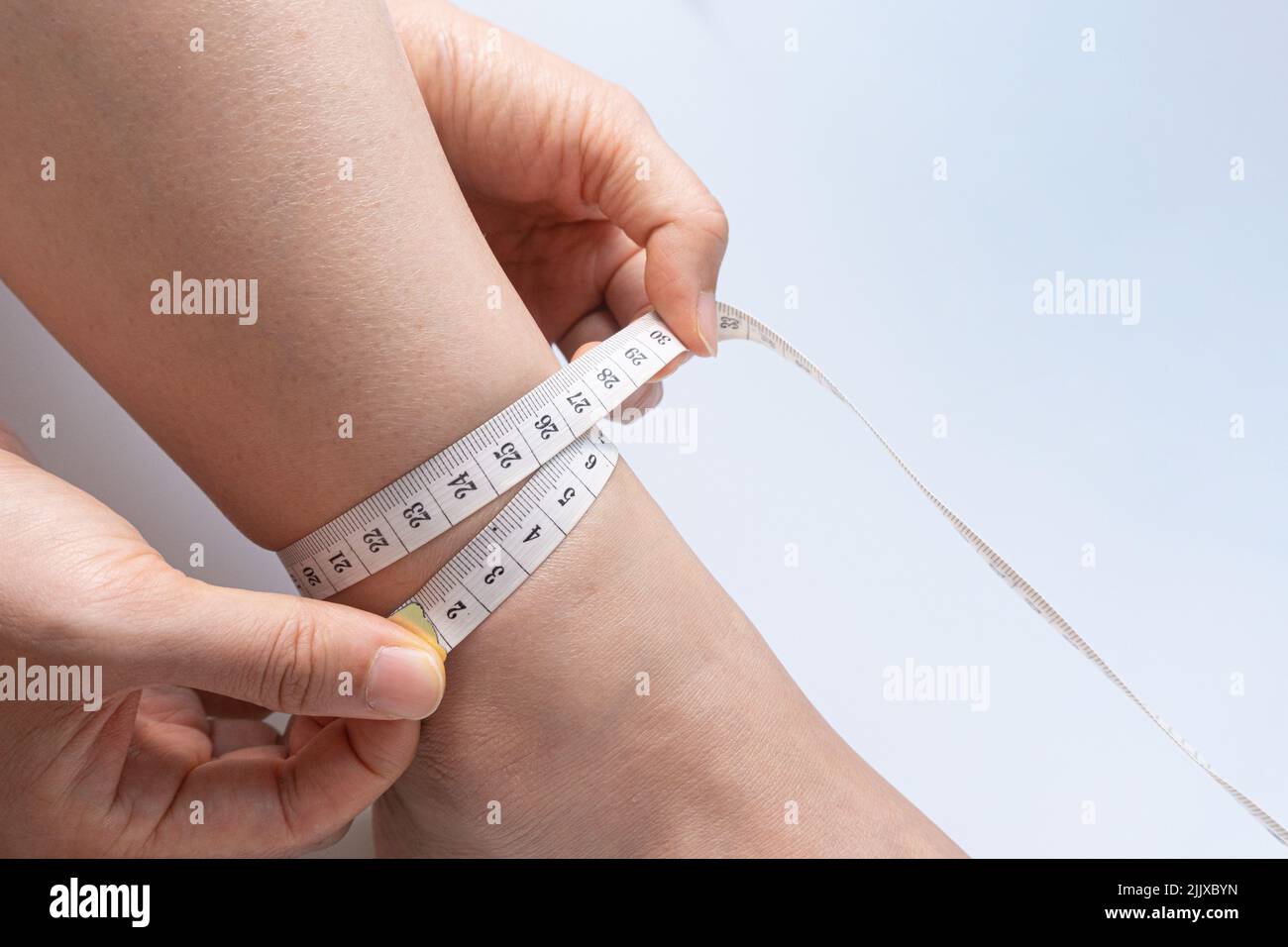 Tape measure to measure various body parts Stock Photo - Alamy