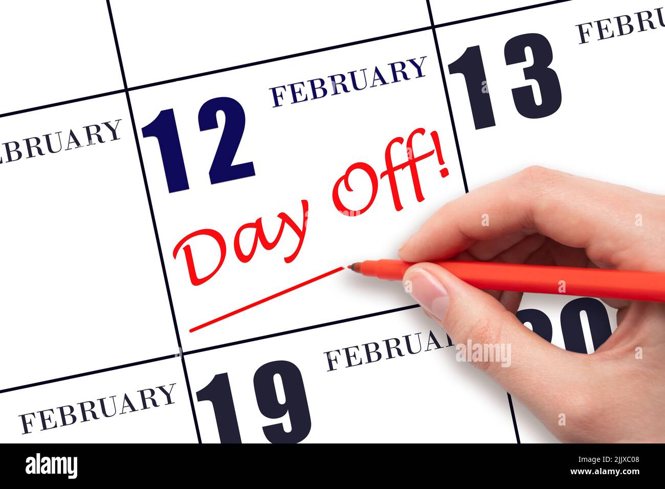 12th day of February. Hand writing text DAY OFF and drawing a line on ...