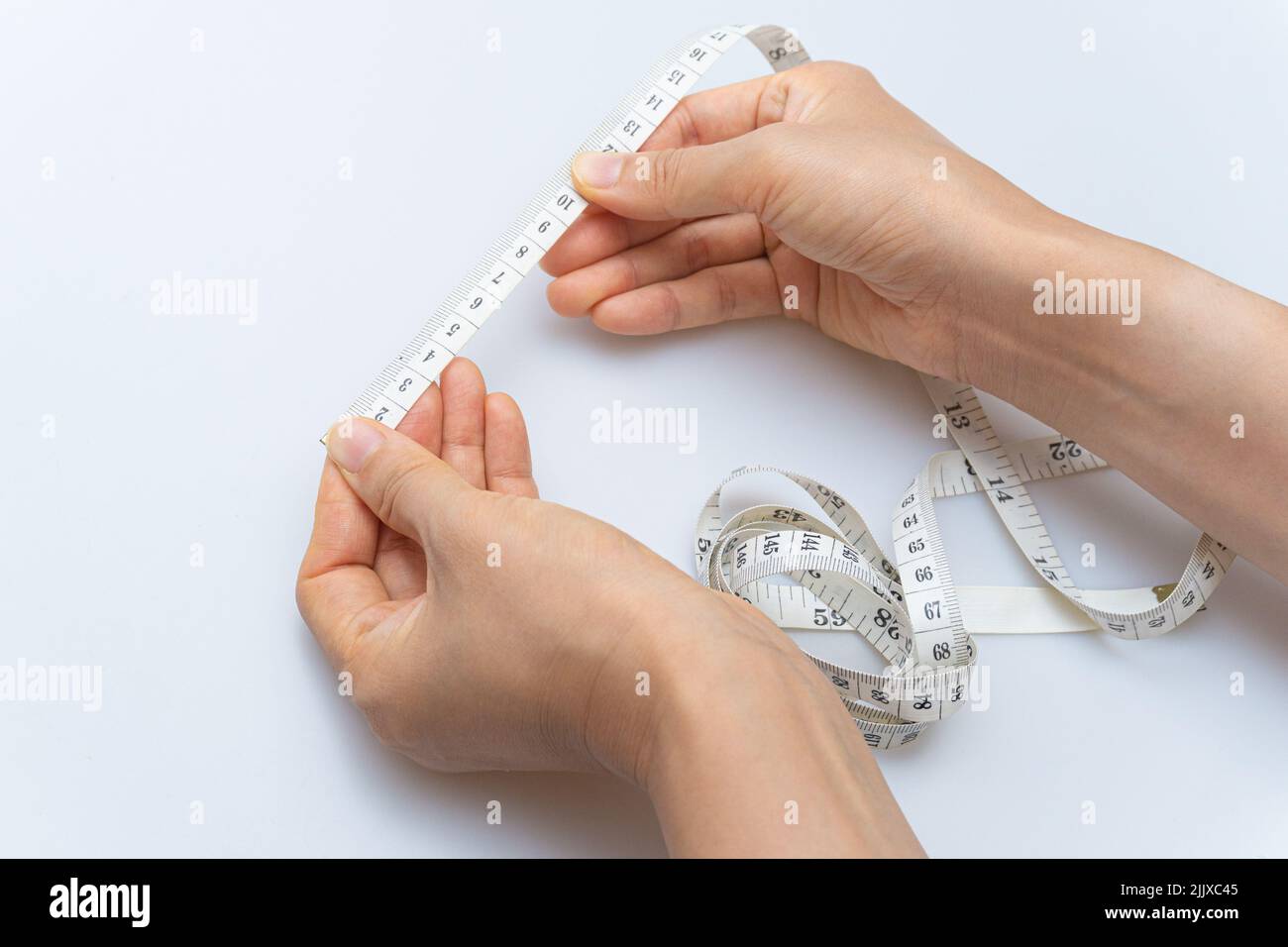 Tape measure to measure various body parts Stock Photo - Alamy