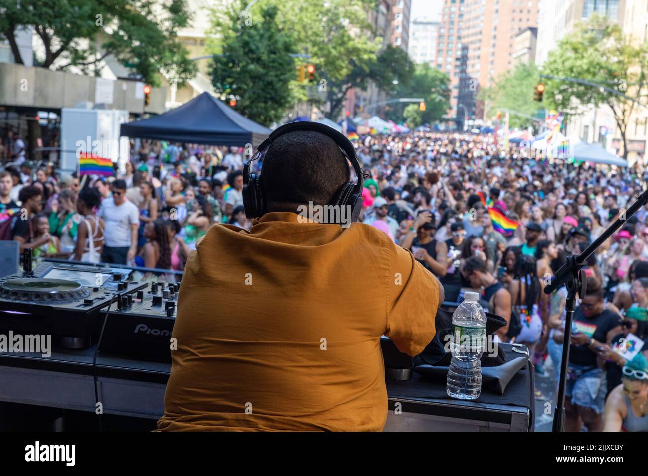 A DJ performing live to a large crowd at Pride Month Parade 2022 in New ...