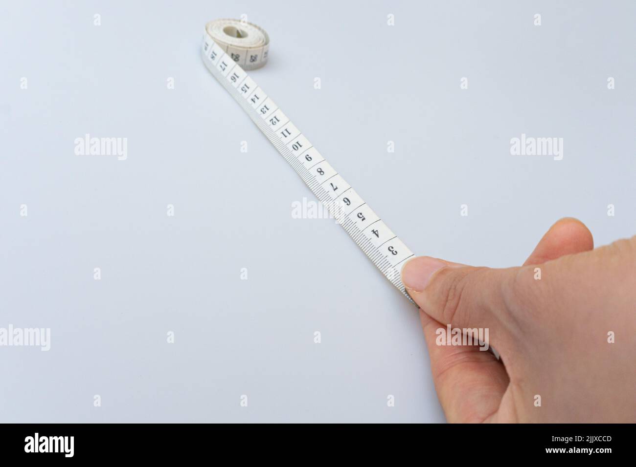 Tape measure to measure various body parts Stock Photo - Alamy