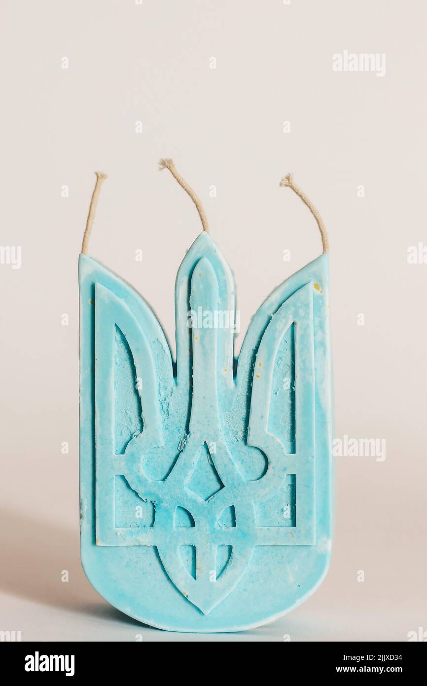 Ukrainian patriotic candle design. Blue candle. Coat of arms of Ukraine ...