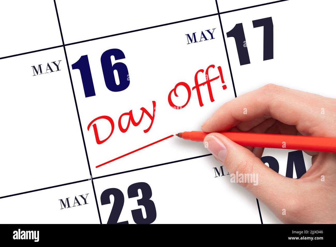 16th day of May. Hand writing text DAY OFF and drawing a line on ...
