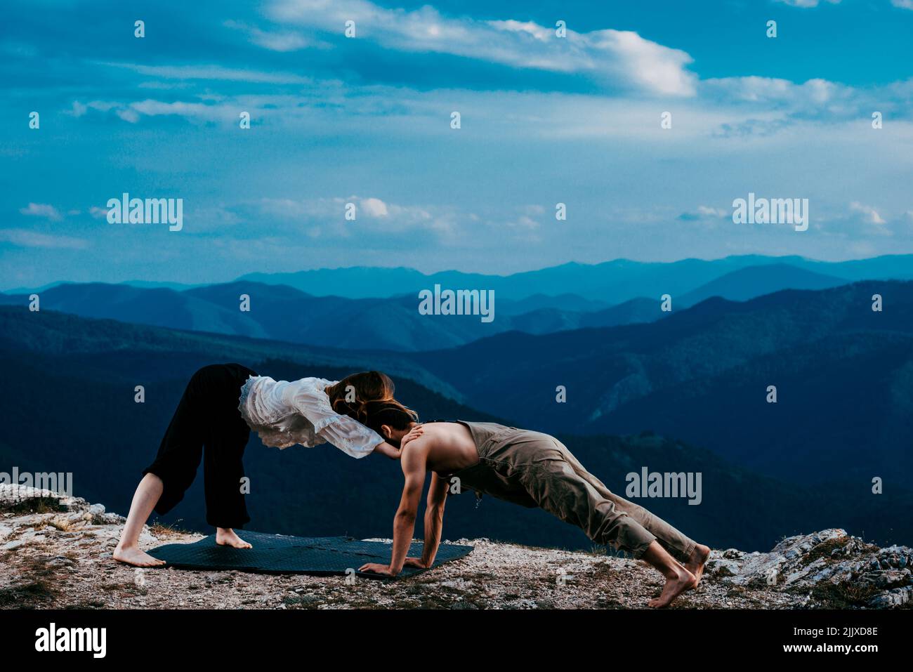 Skillful hip-hop dancers in movement. Young couple of modern dance ...