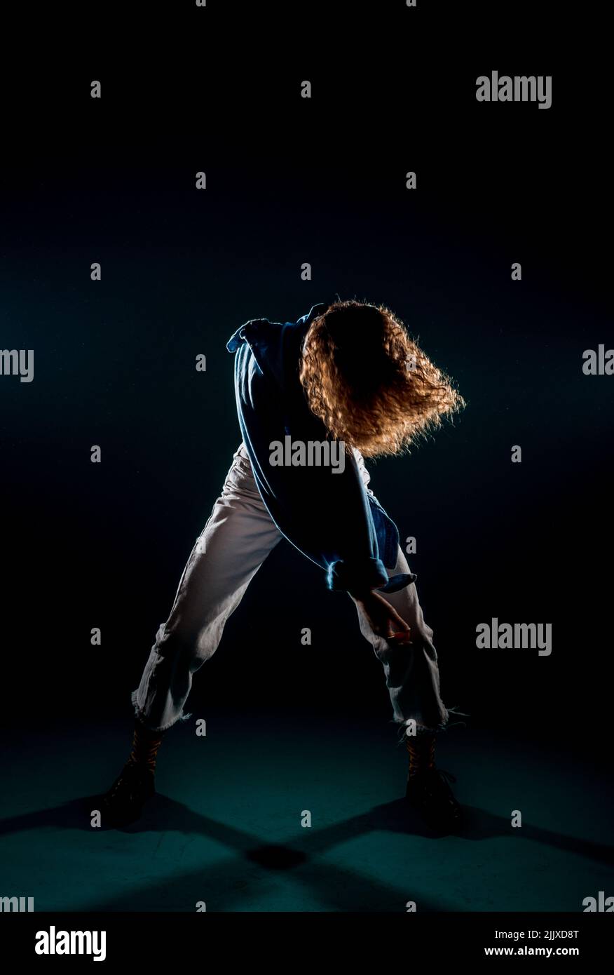 Athletic dancer performing an element of dance gymnastics Stock Photo ...