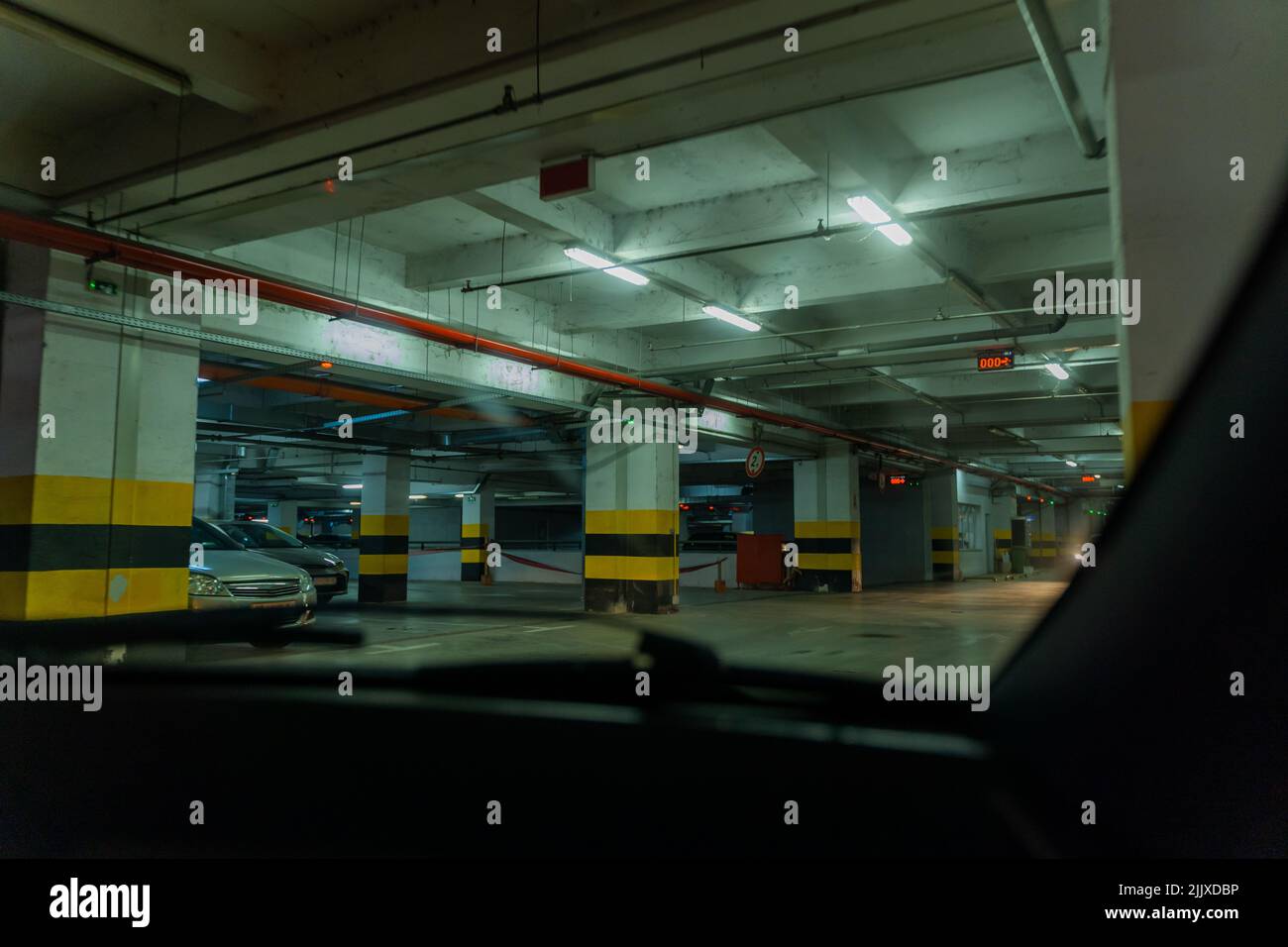 Group of amazing and attractive friends are driving in the parking area ...