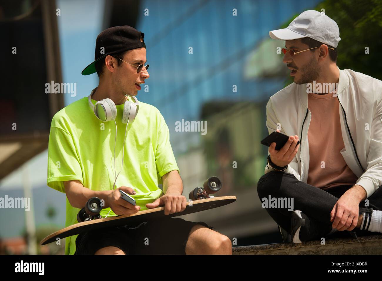 Two male friends are having a serious conversation about the phones ...