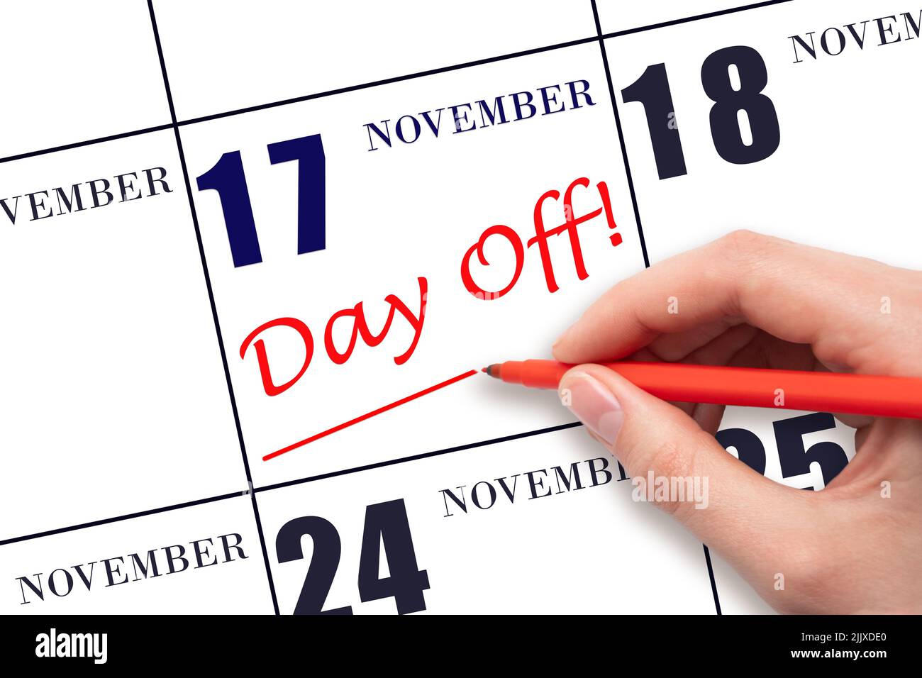17th day of November. Hand writing text DAY OFF and drawing a line on ...