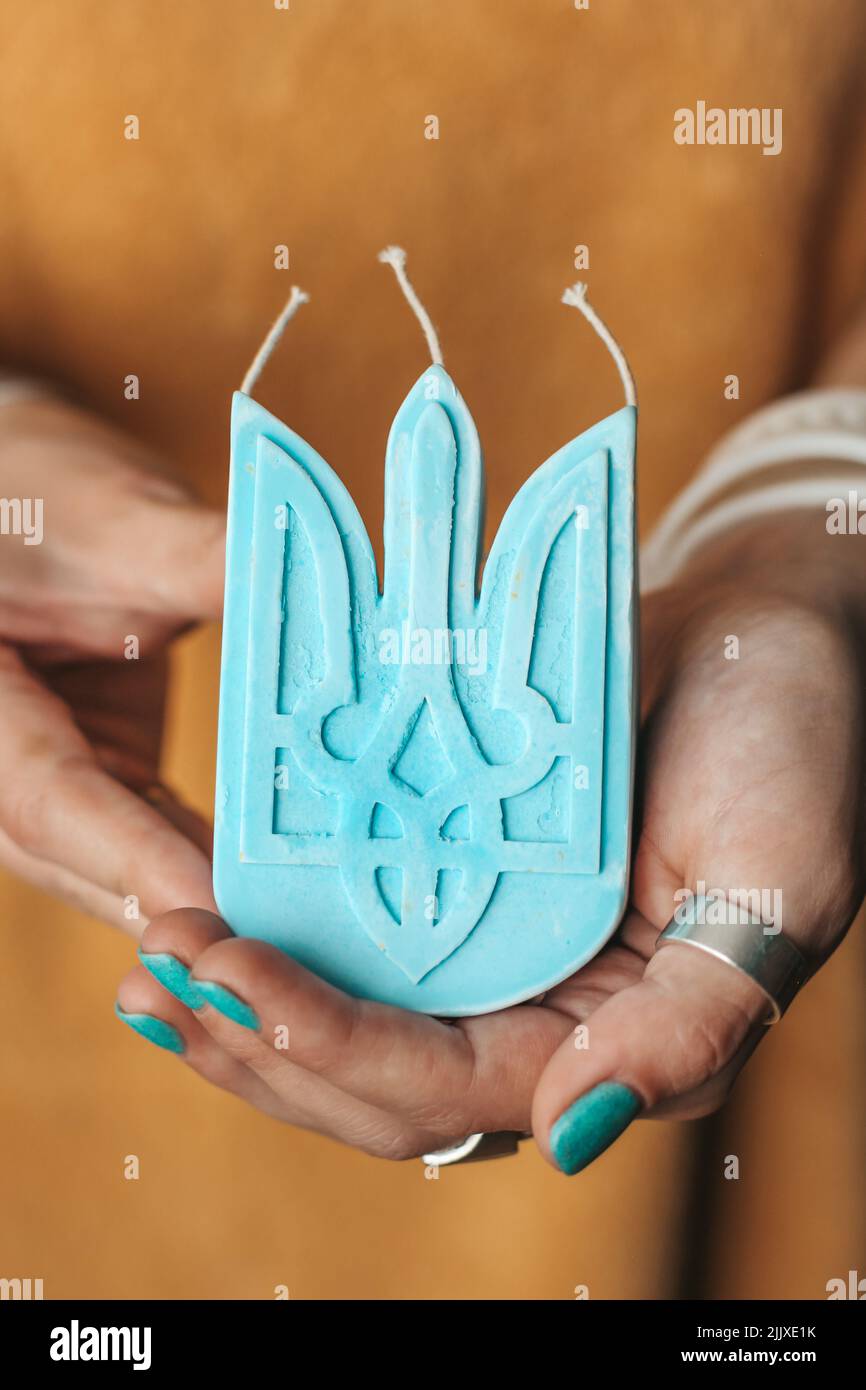 Ukrainian patriotic candle design. Blue candle. Coat of arms of Ukraine ...