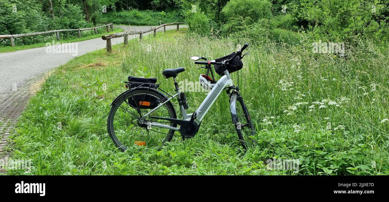 Spring landscape with an e-bike on the way Stock Photo - Alamy