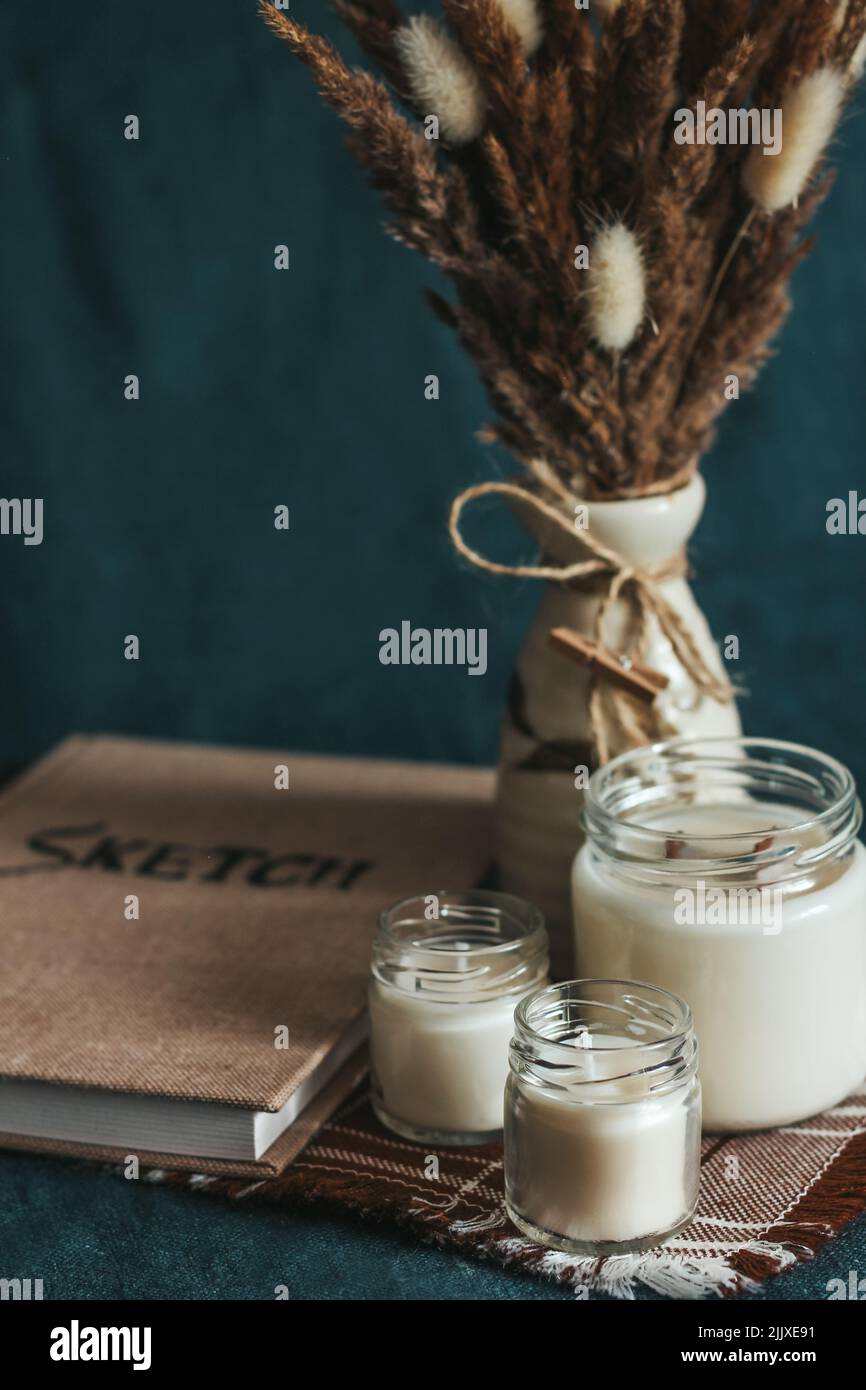 Scented candles in the interior. Interior details in milk colors ...