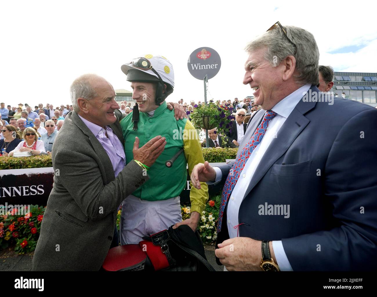 Liam McKenna with trainer Tony Martin (left) and owner John Breslin ...