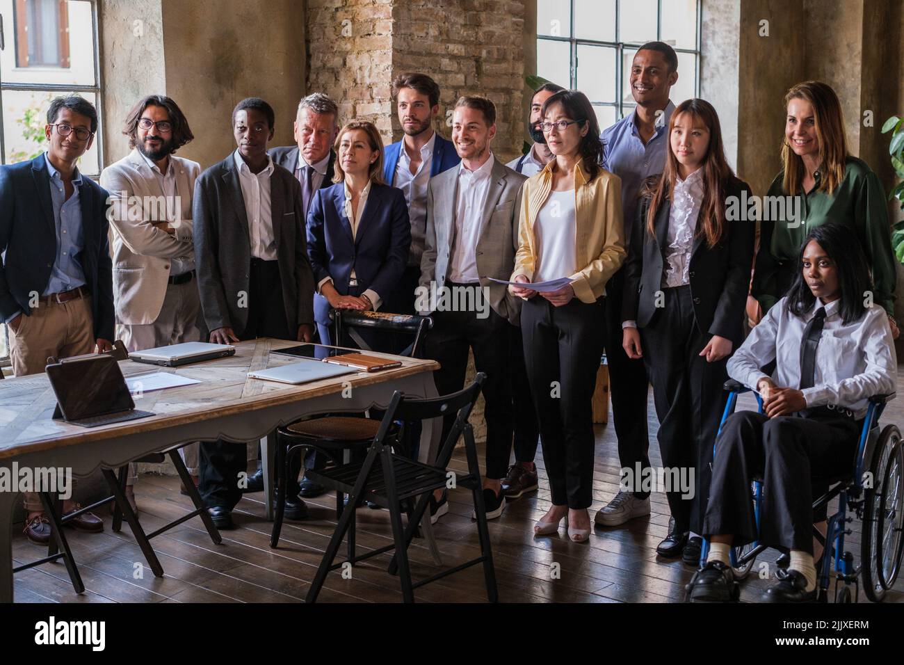 Group of multicultural business people from a coworking space standing ...