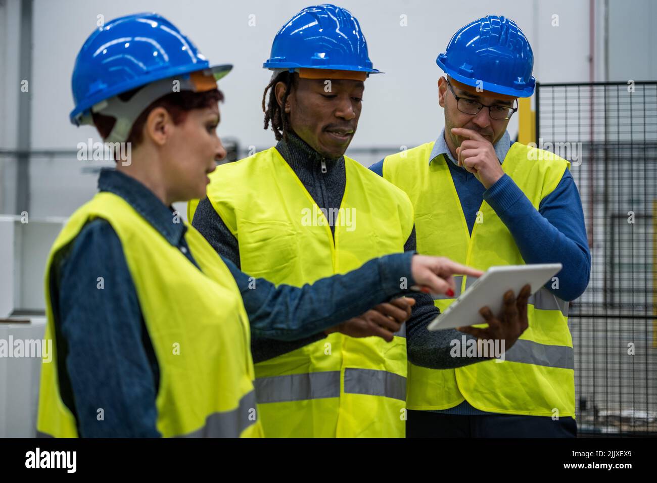 Engineers reviewing data on the tablet of the tests carried out in the ...