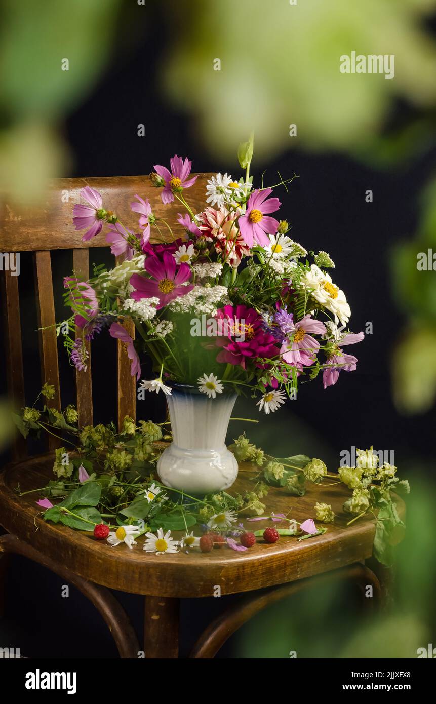 Gorgeous summer still life with a bouquet of multi-colored garden and ...