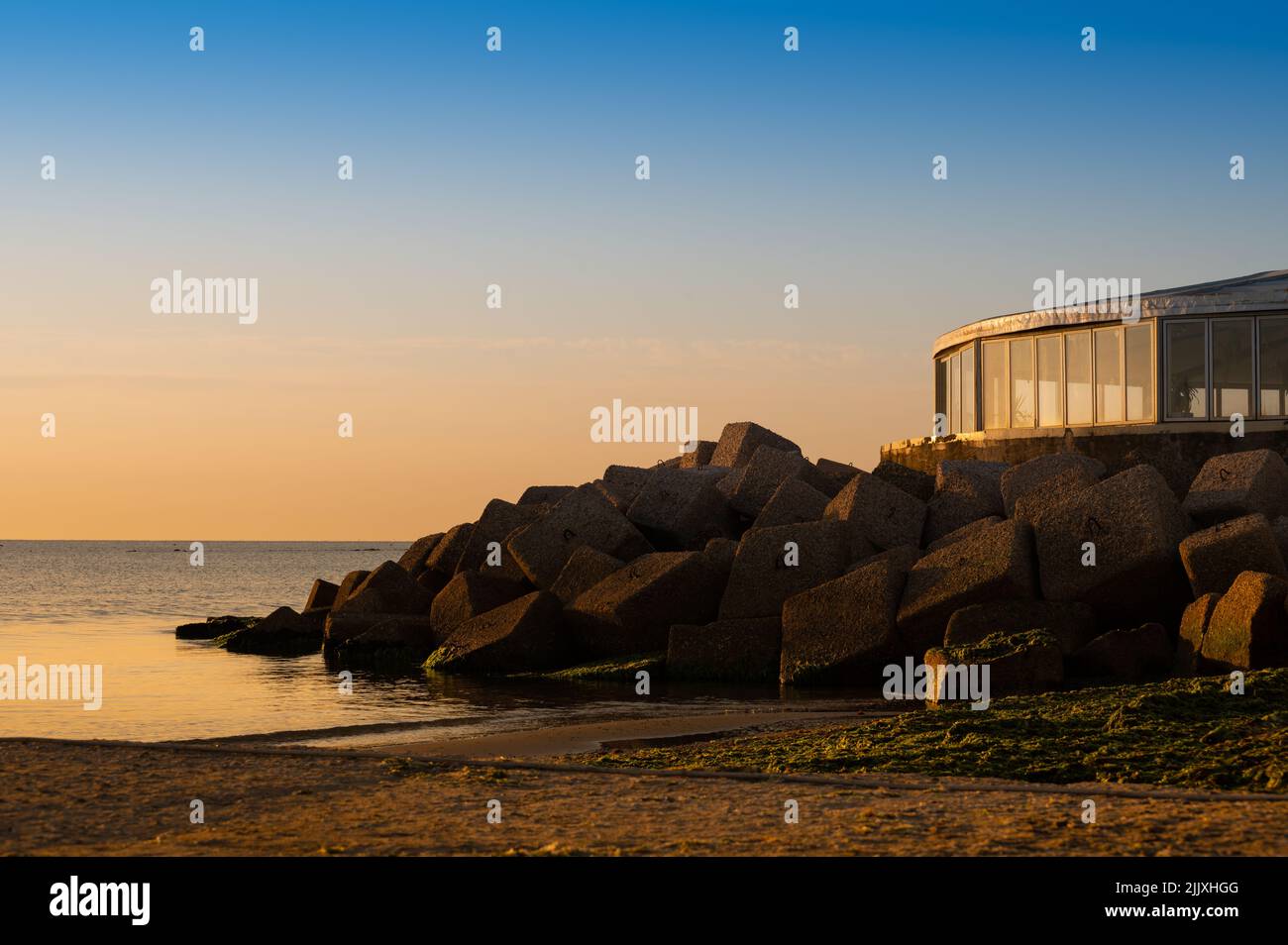 Restaurant with bay windows by the sea at dawn Stock Photo - Alamy