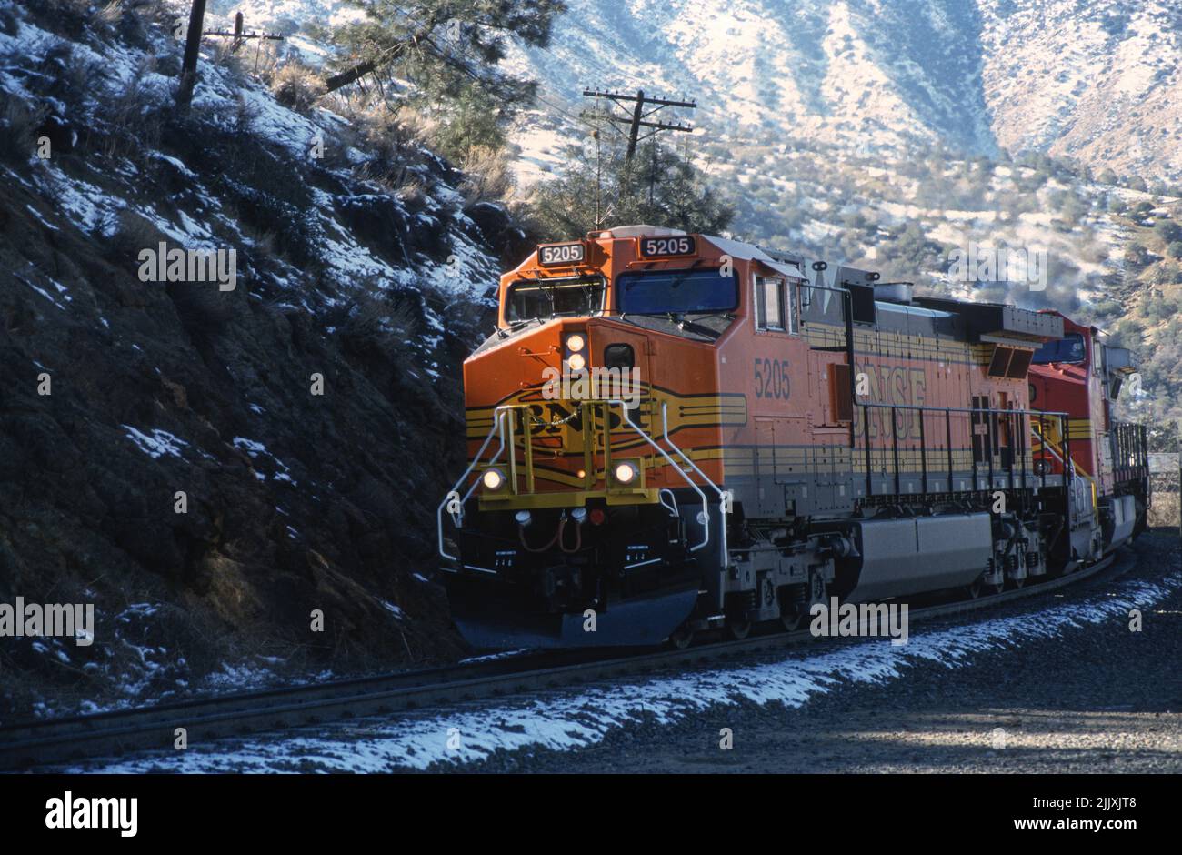 BNSF 5205 heads past the Tehachapi Loop and into Tunnel 10 in Tehachapi, California Stock Photo ...