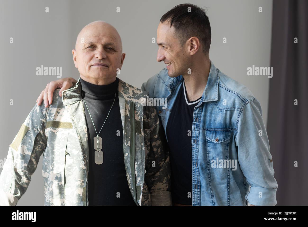 cheerful american military soldier standing with father Stock Photo - Alamy
