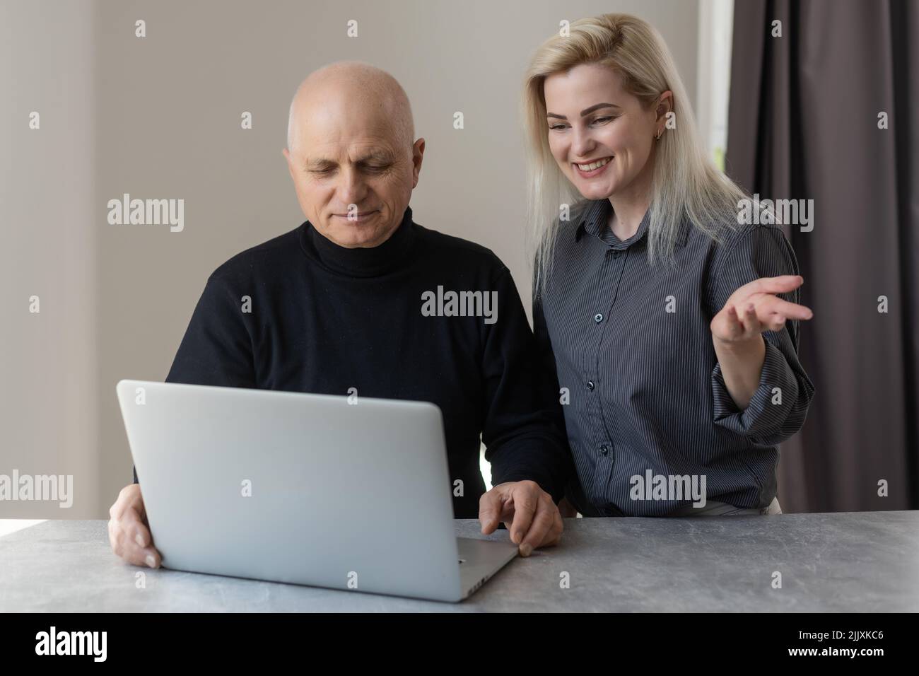 Front view happy elderly 70s grey haired man learning using computer ...