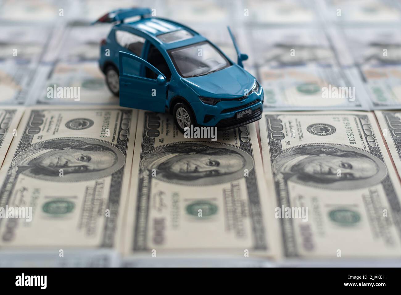 Toy car dollar bills hi-res stock photography and images - Alamy