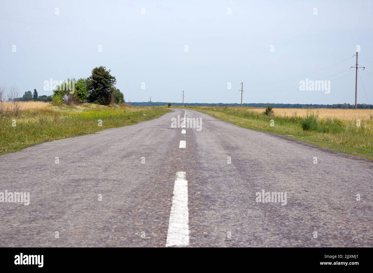 Old motor road in the countryside in summer Stock Photo - Alamy