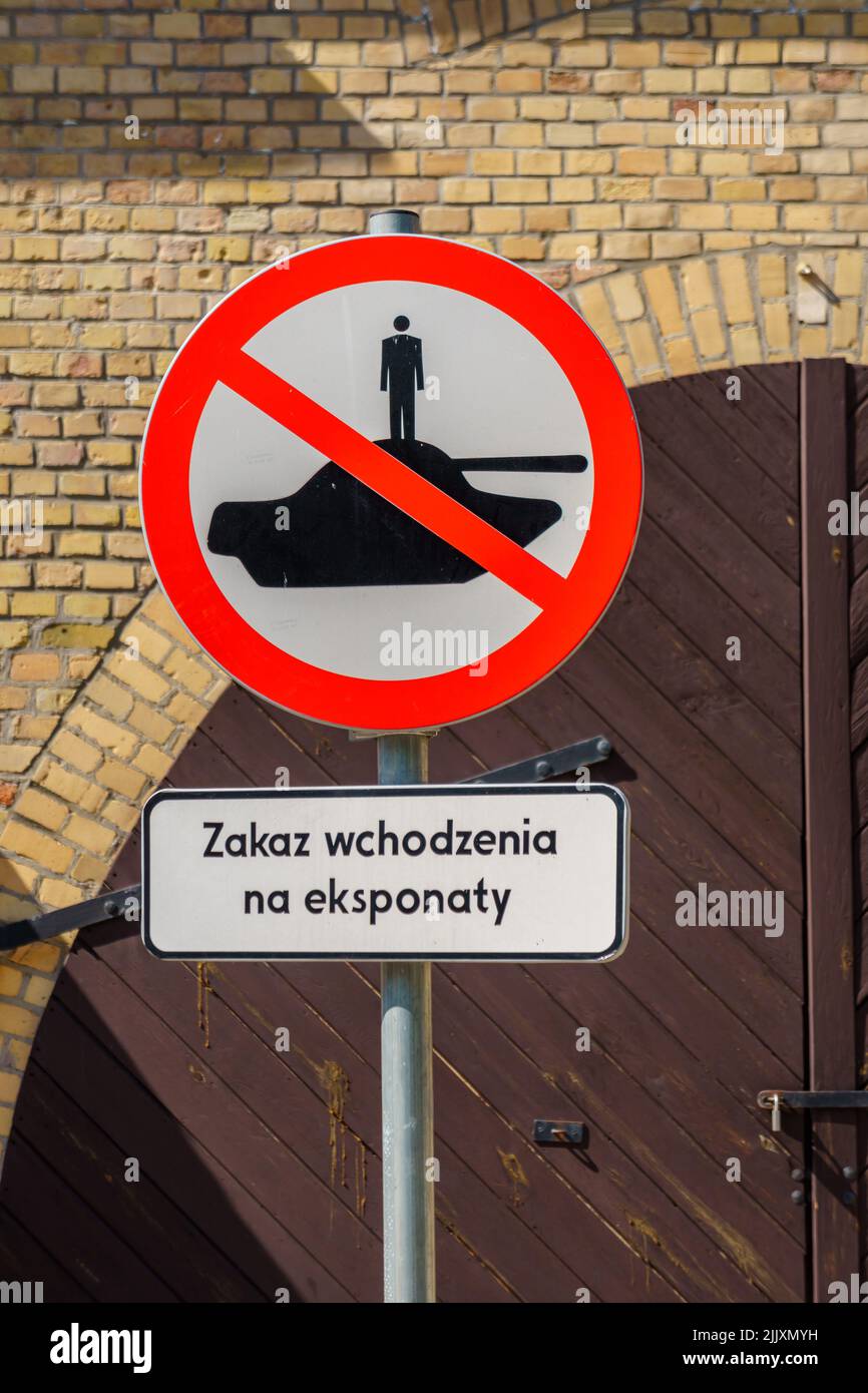 A warning sign saying forbidden to stand on the exhibition tanks in ...