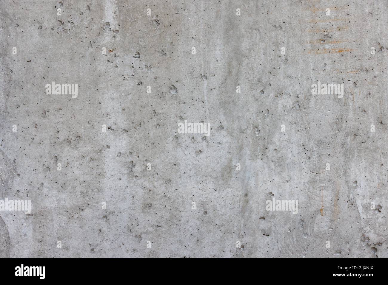 Gray embossed texture of a gray concrete wall with potholes and cracks ...