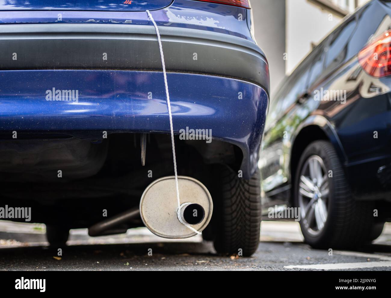 28 July 2022, Hessen, Frankfurt/Main: A new exhaust is attached to a ...