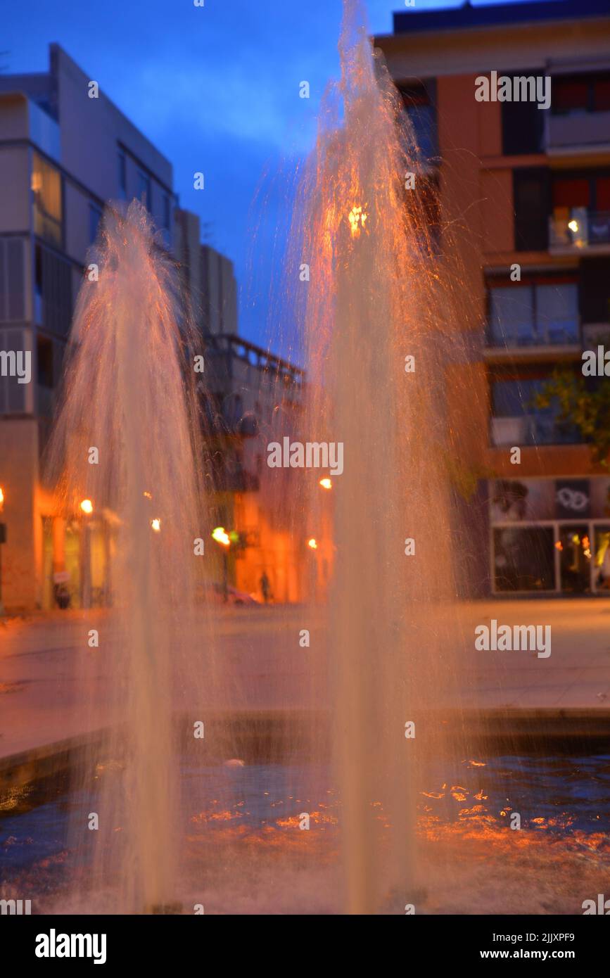 Moving water in the square fountain Stock Photo - Alamy