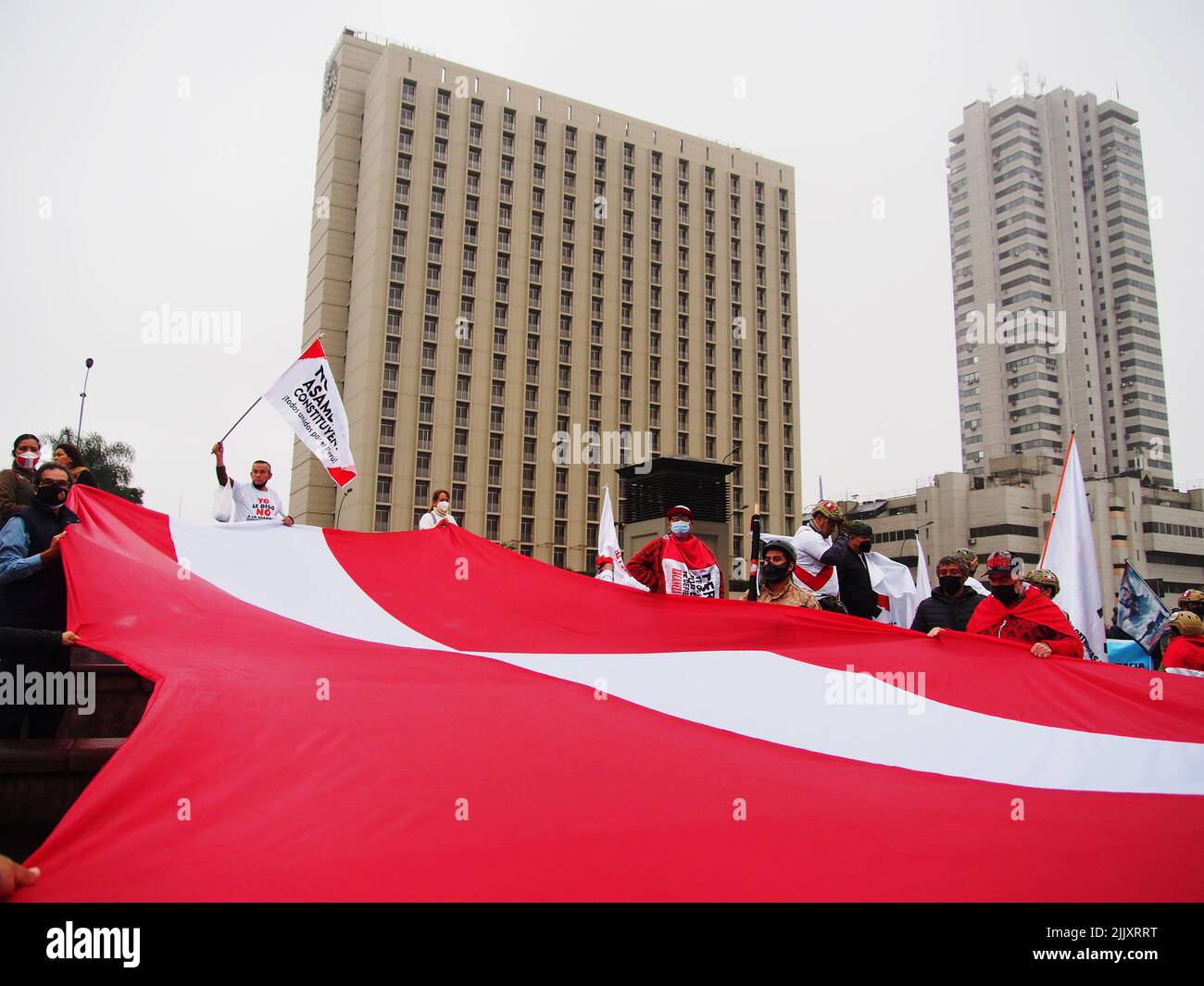 Giant Peruvian flag carried by protesters when on Peru's independence ...