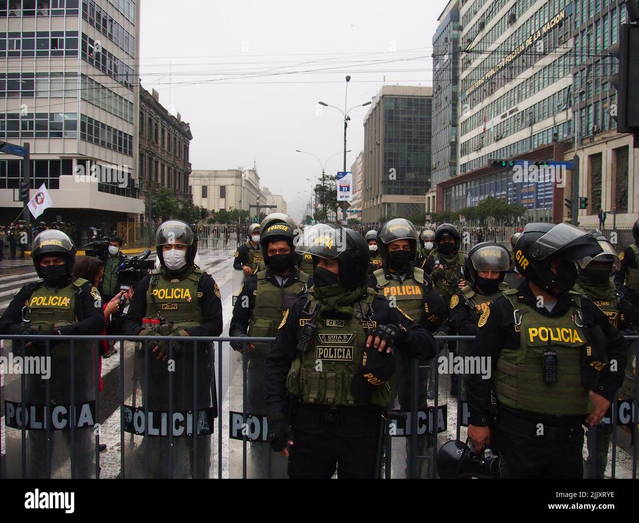 Police guarding the streets when on Peru's independence day, hundreds ...