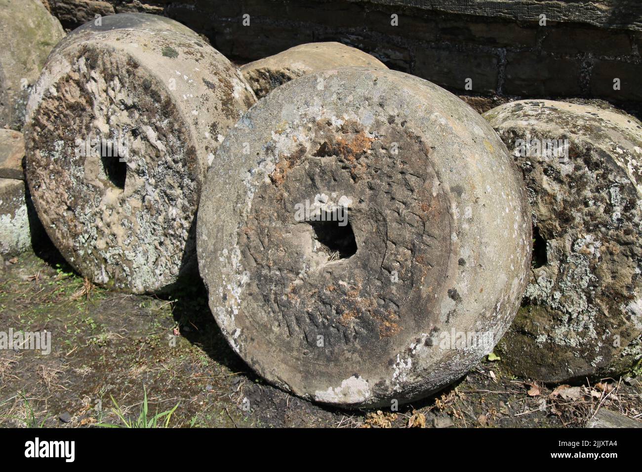 A Pile of Discarded Round Granite Mill Stones Stock Photo - Alamy