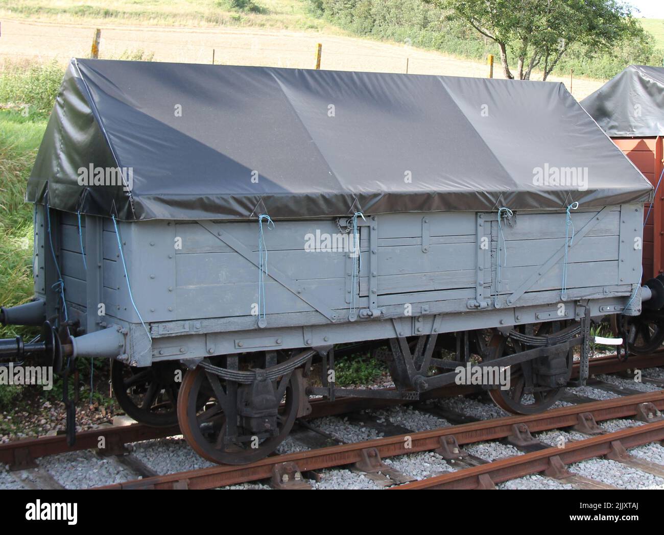A Covered Traditional Wooden Train Freight Wagon Stock Photo - Alamy