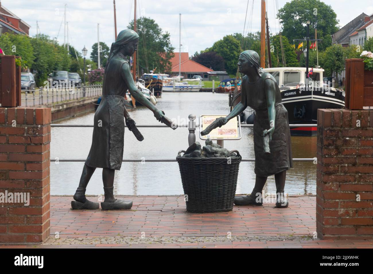 The bronze figures Peat Women are located in the historic harbor of ...