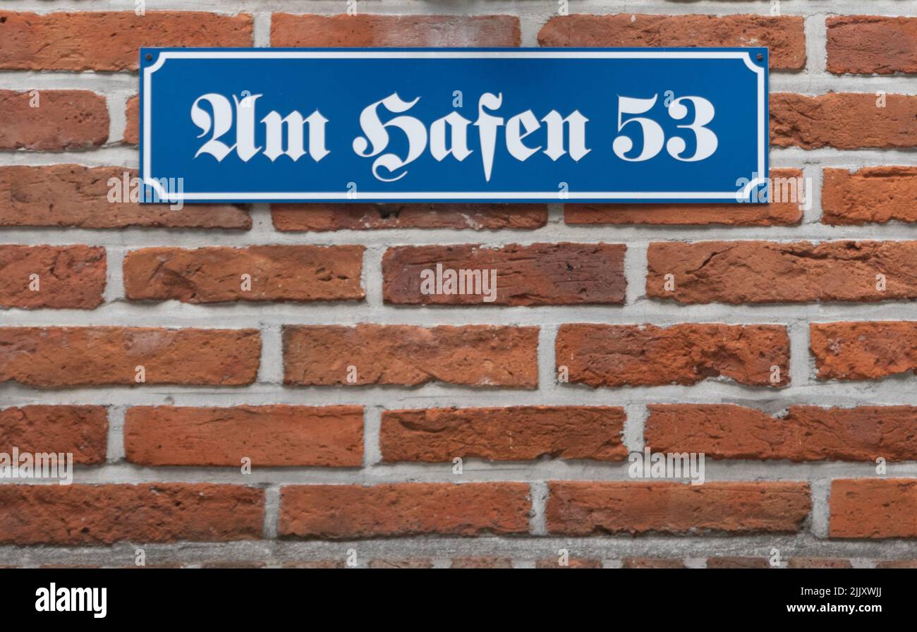 Sign Am Hafen 53 on a brick building at the historic harbor of Weener ...