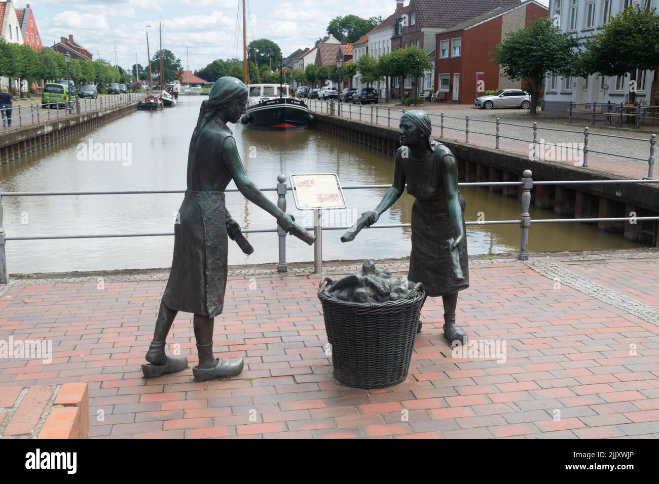 The bronze figures Peat Women are located in the historic harbor of ...