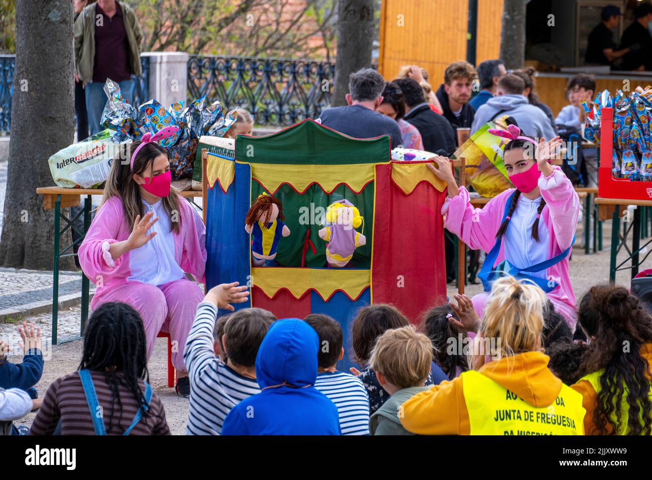 Children and performers at an outdoor puppet show in Lisbon, Portugal ...