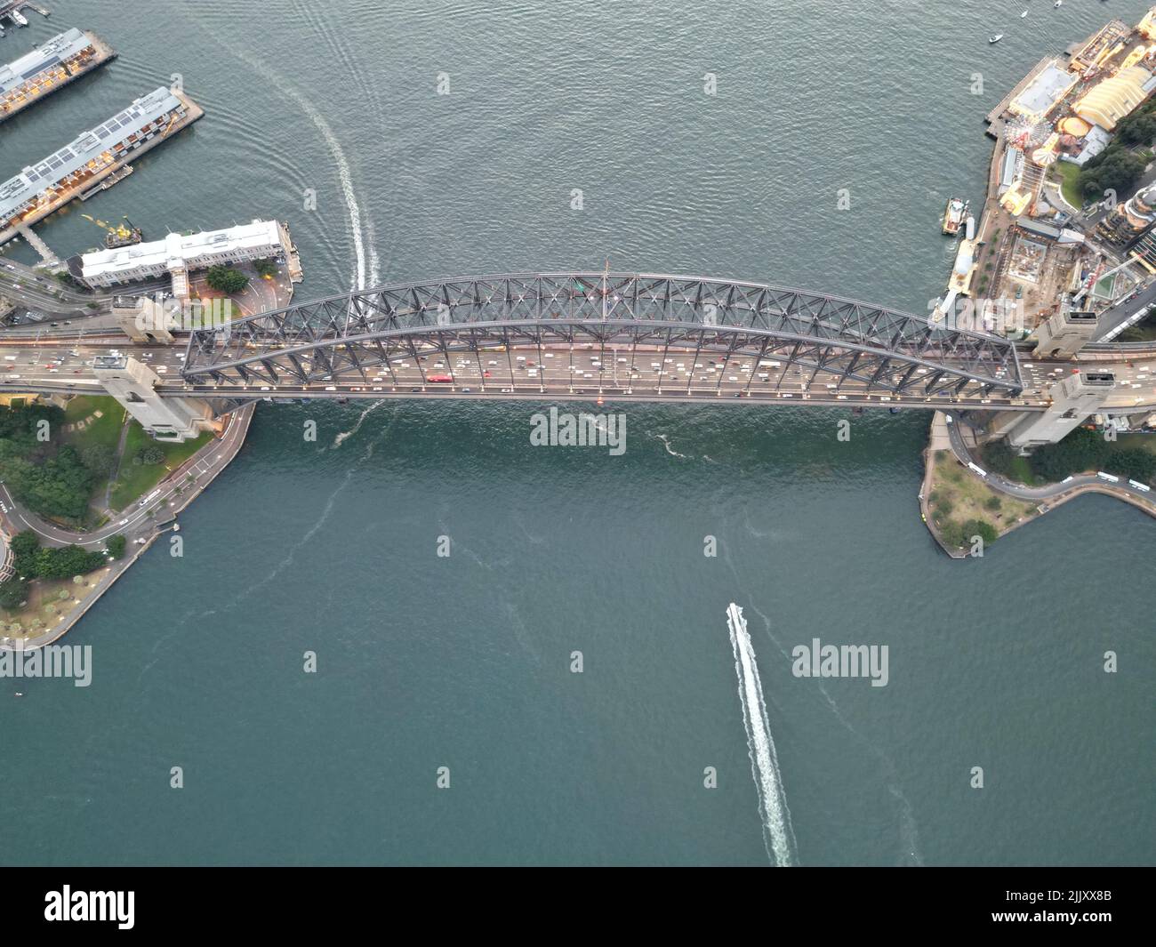 An aerial view of the Sydney harbor bridge and transportation traffic ...