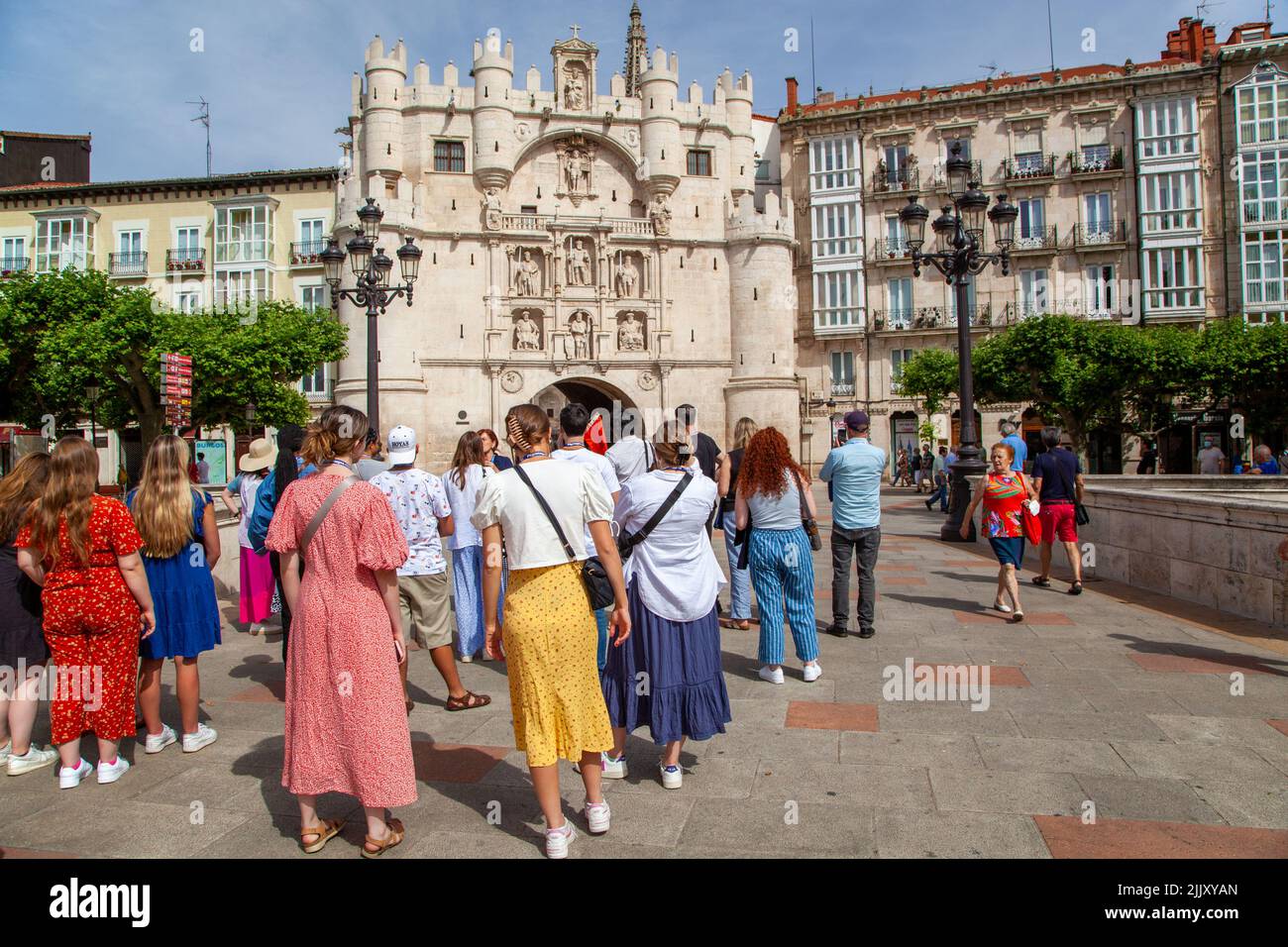 Tourists and sightseers on a guided tour of the Spanish city of Burgos ...