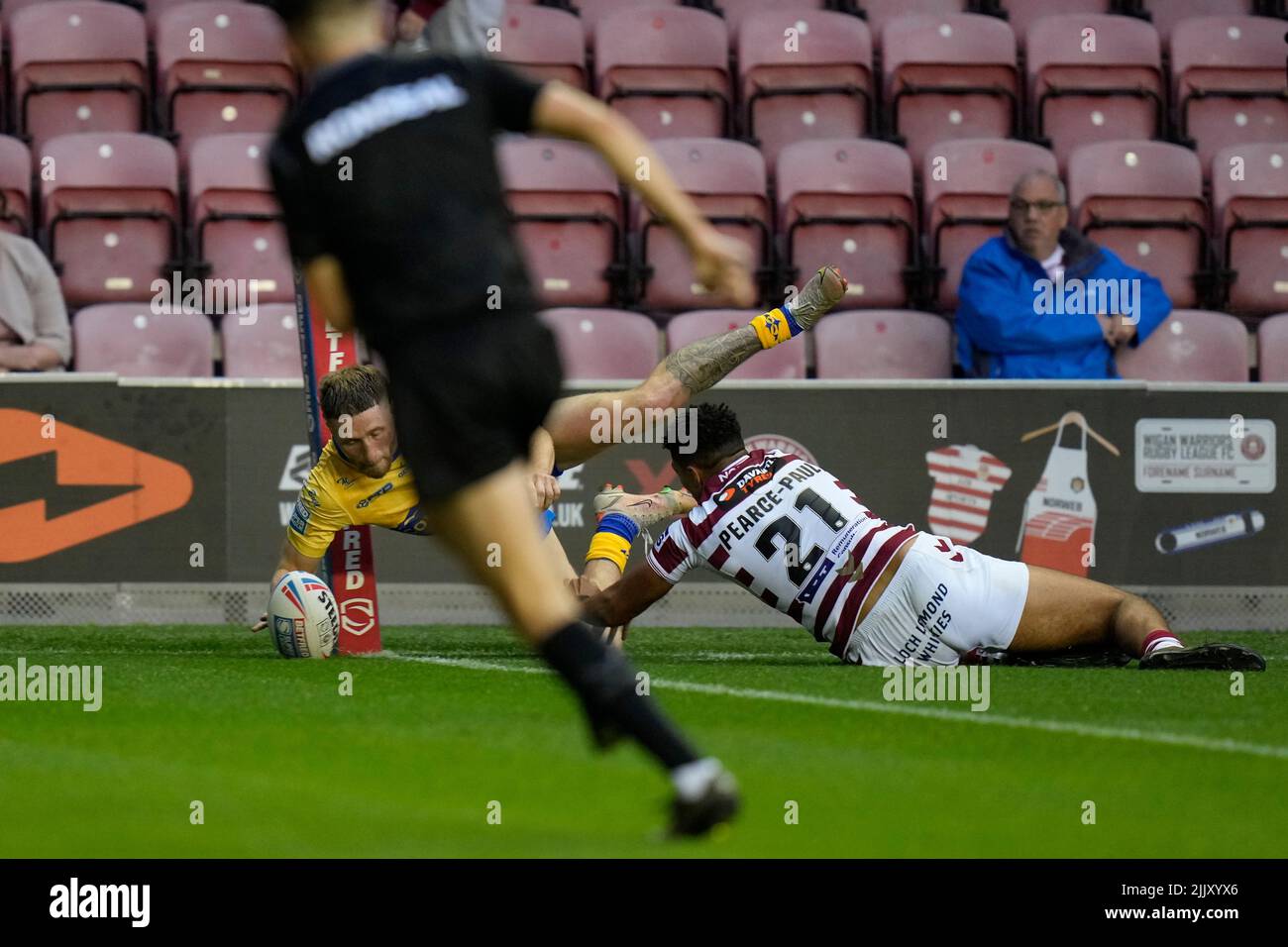 Wigan, UK. 28th July, 2022. Ethan Ryan #23 of Hull KR dives over to ...