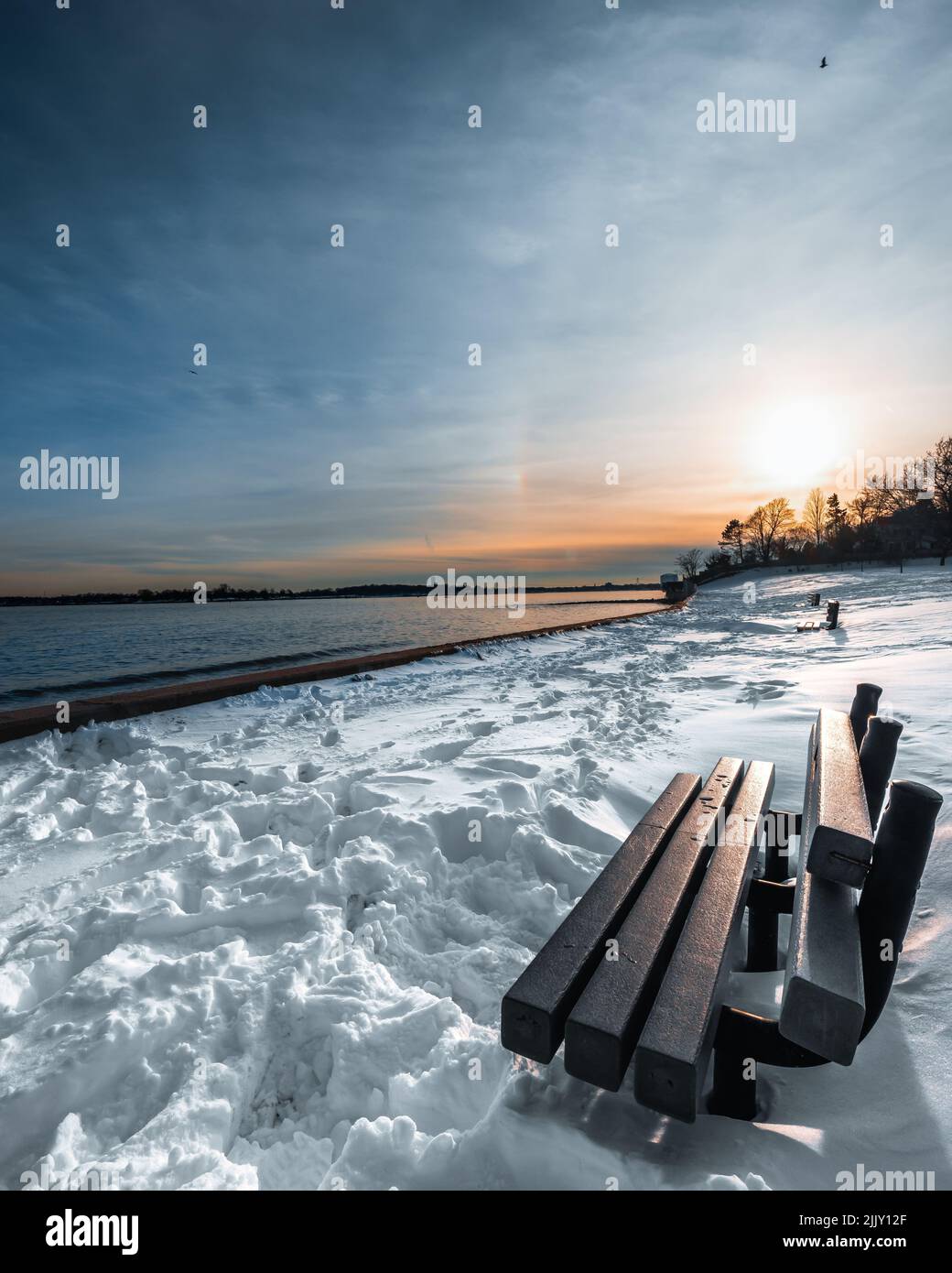 A snowy beach on a sunset Stock Photo - Alamy