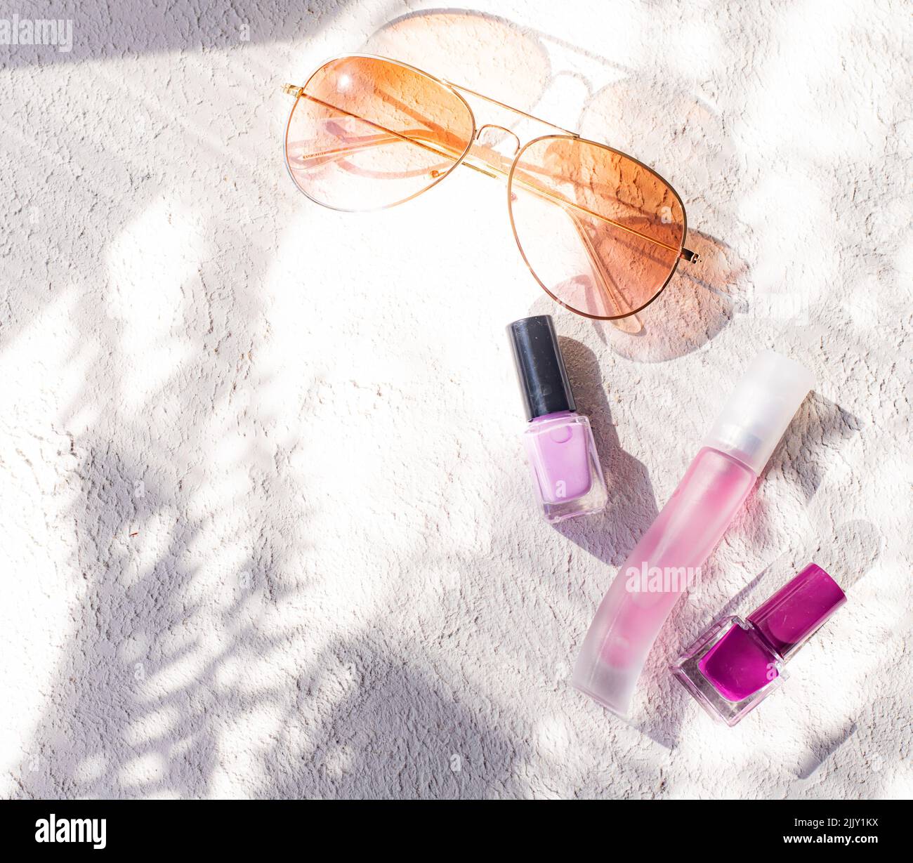 The layout of cosmetics and sun rays . Cosmetics and shadows ...