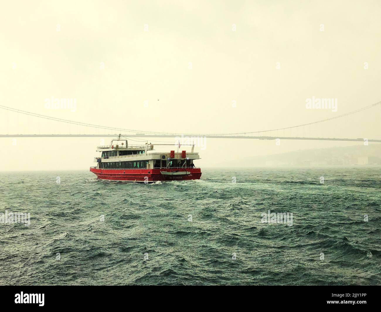 A large red white ferry sailing on stormy waters Stock Photo - Alamy