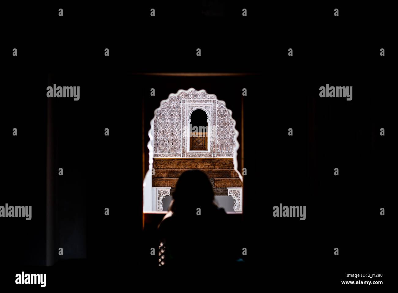 Arabic style ancient arch silhouette with person silhouette on an old ...